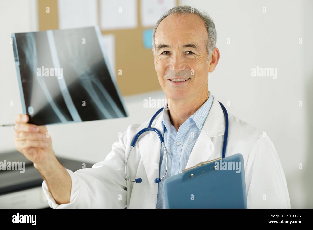 a senior doctor holding xray Stock Photo - Alamy