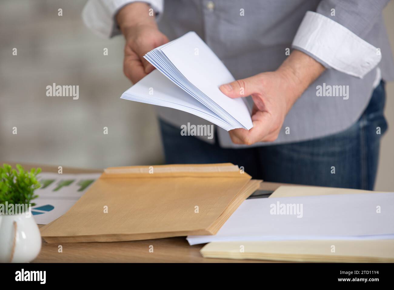 Hand taking exam on desk hi-res stock photography and images - Alamy