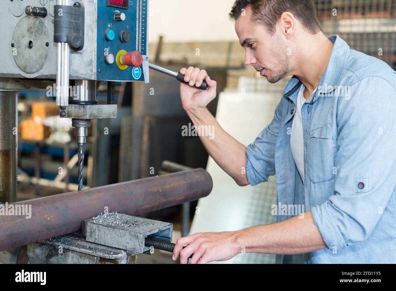 Man drilling hole factory hi-res stock photography and images - Alamy