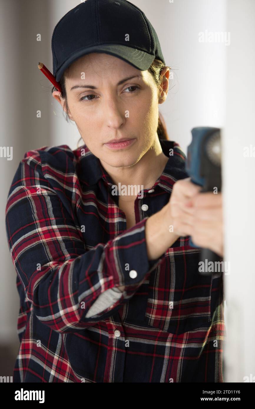 Woman using cordless drill screw hi-res stock photography and images ...