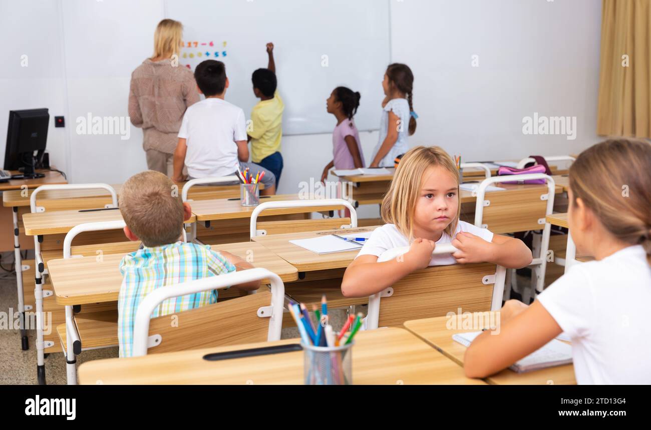 Tween boys and girls friendly talking in break in classroom Stock Photo ...