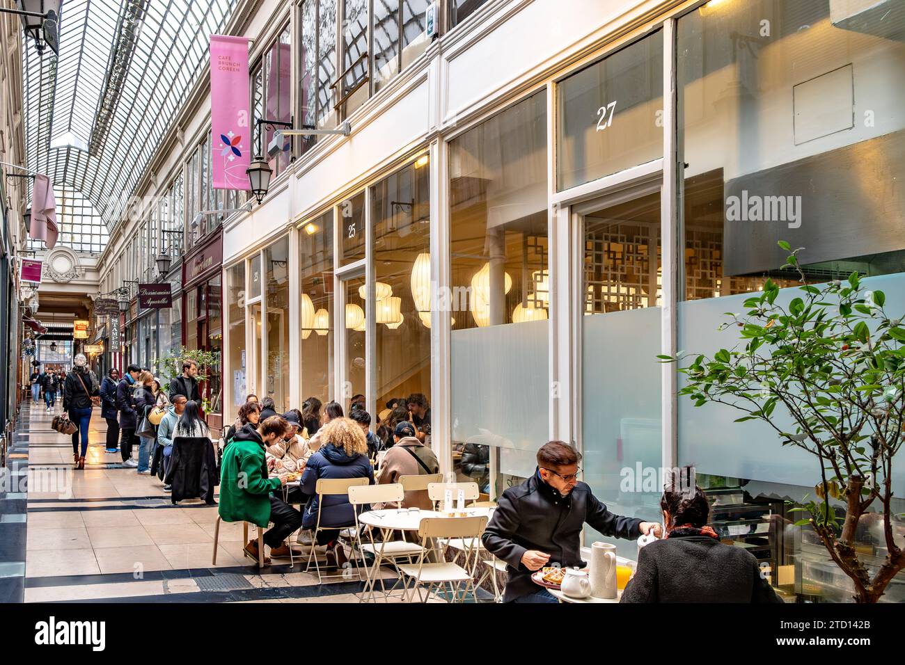 People sitting down eating outside Keopi ,a cafe specializing in Korean ...