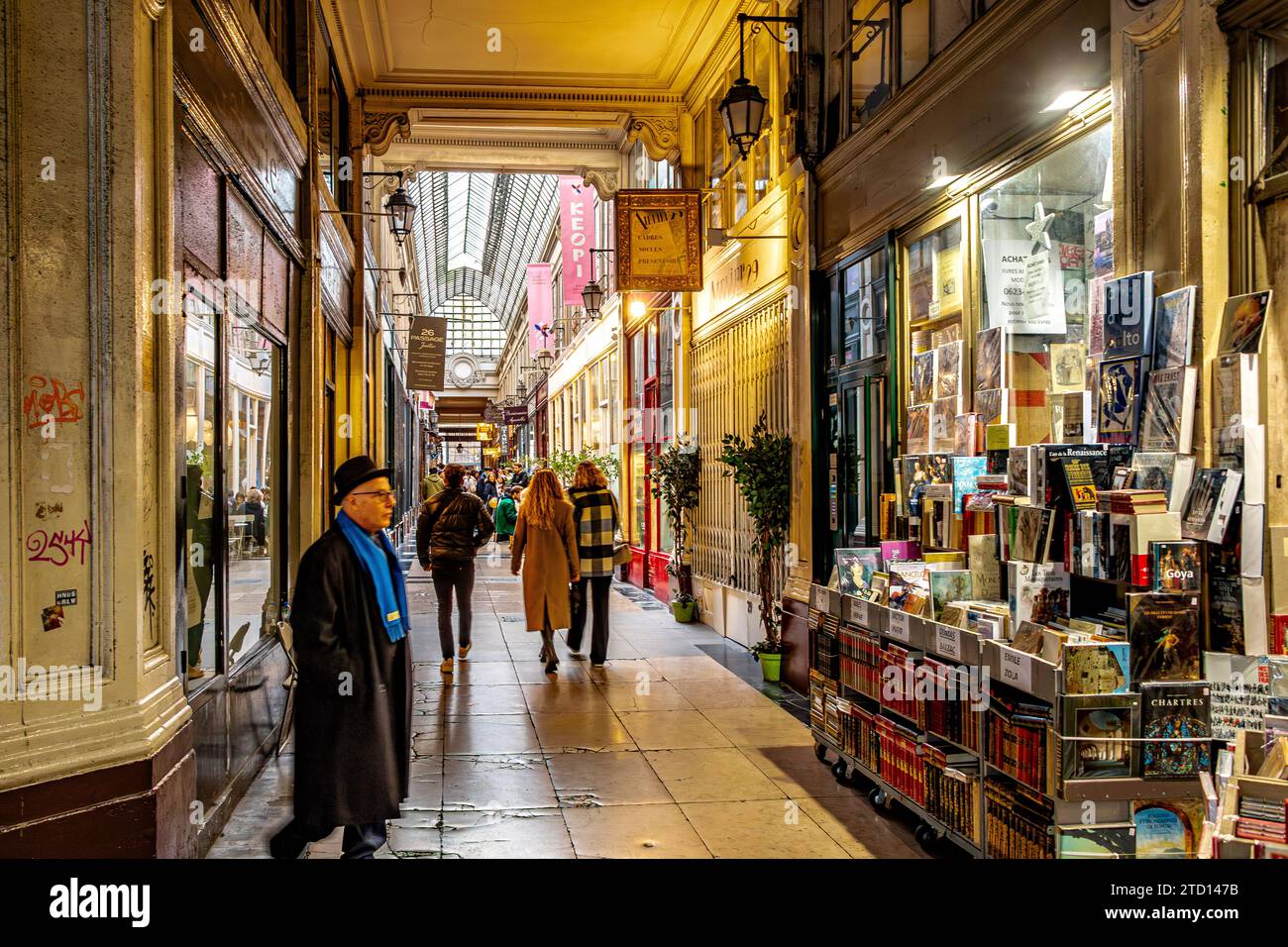 People walking through Passage Verdeau a covered passageway in the 9th ...