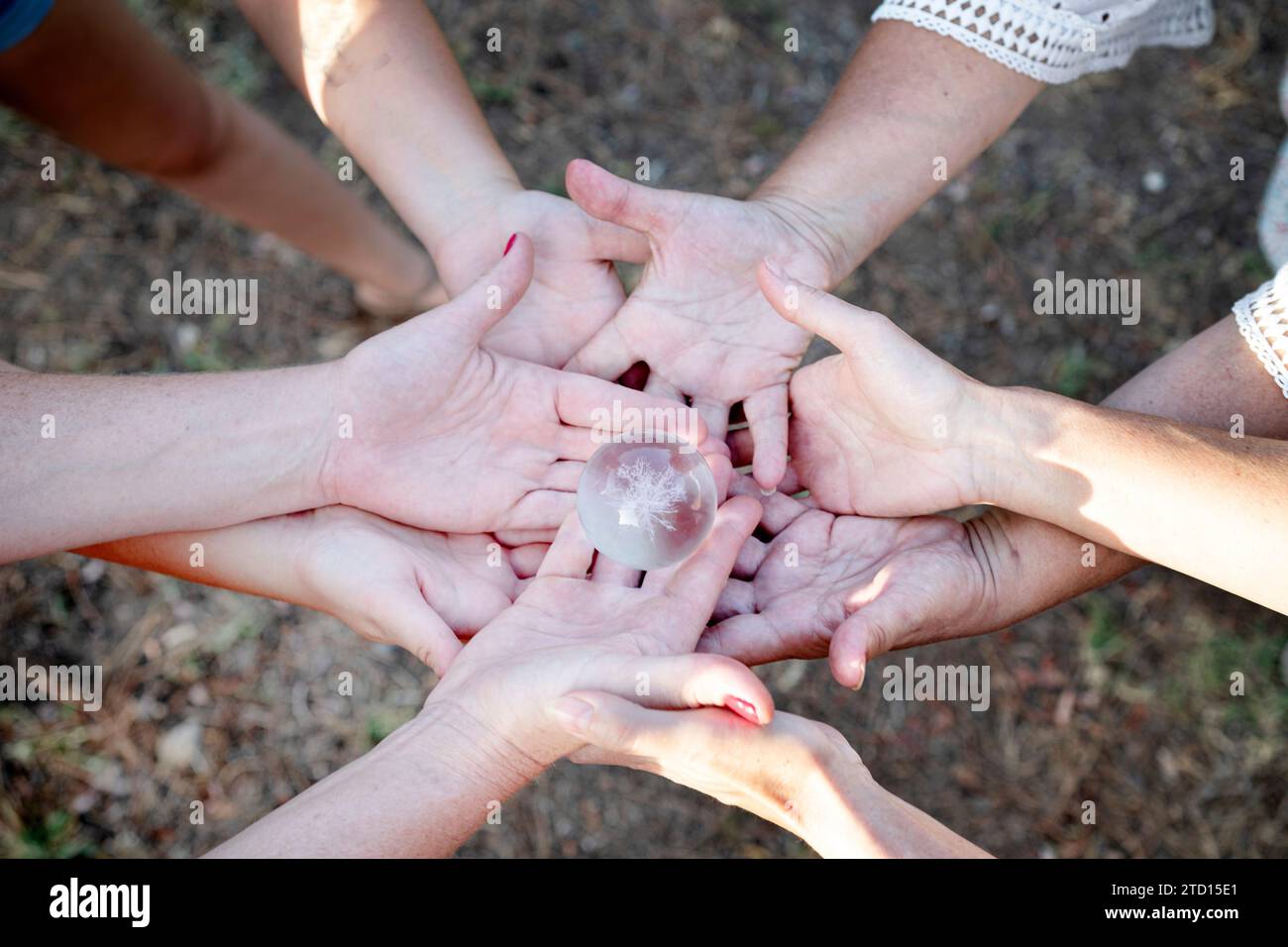 Group people joining hands in hi-res stock photography and images - Alamy