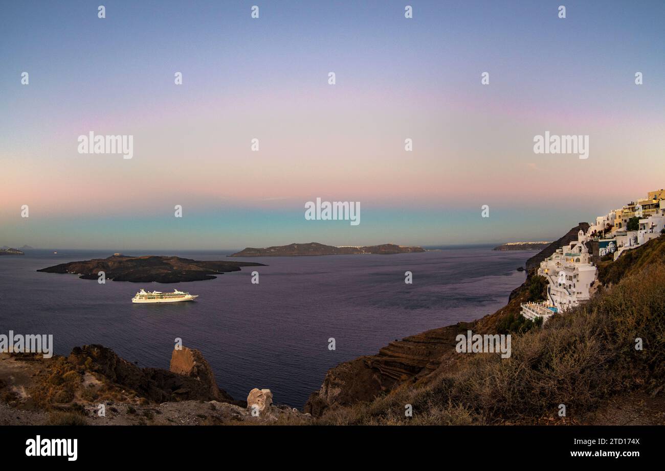 Dawn comes to the caldera of Santorini, from Fira, Greece Stock Photo ...