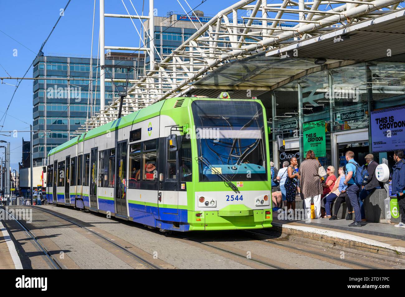 London Trams tram waiting at a stop outside East Croydon railway ...