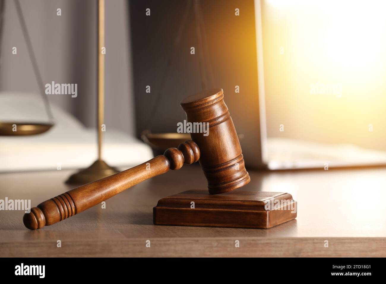 Law. Judge's gavel and scales of justice on wooden table Stock Photo ...