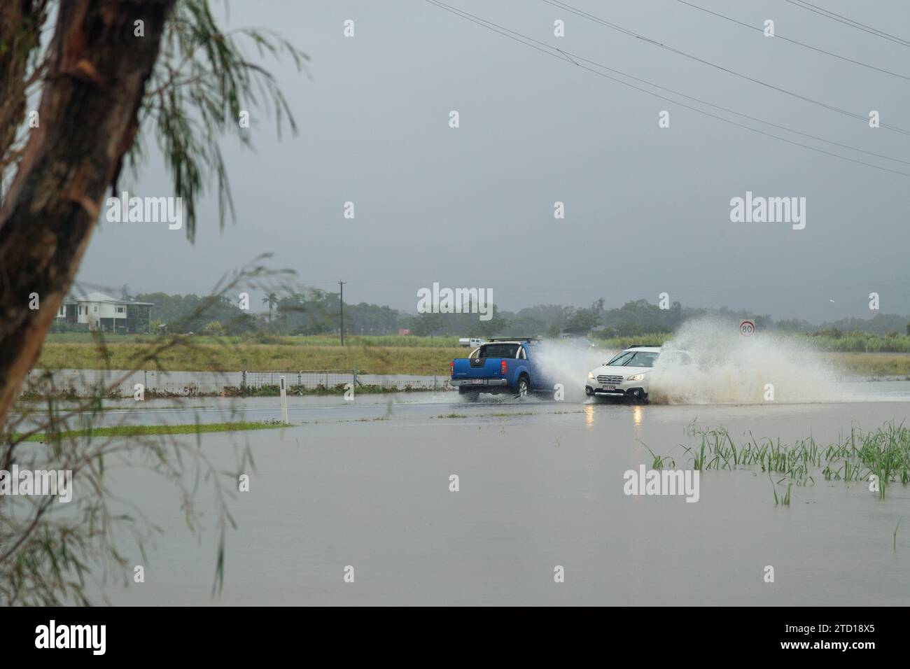 Cars attempt to pass a road in the northern beaches suburb of Holloways ...