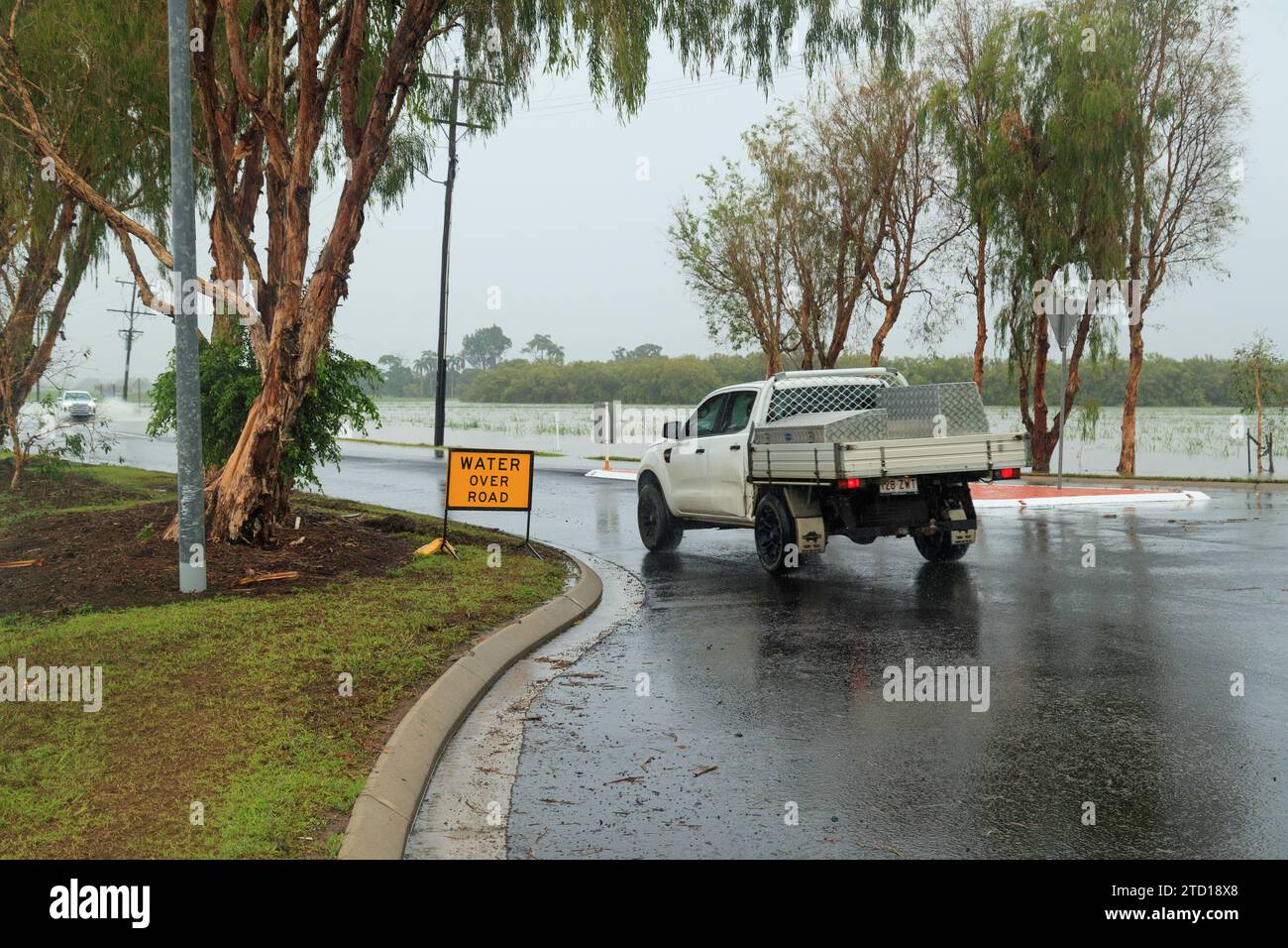Cars attempt to pass a road in the northern beaches suburb of Holloways ...