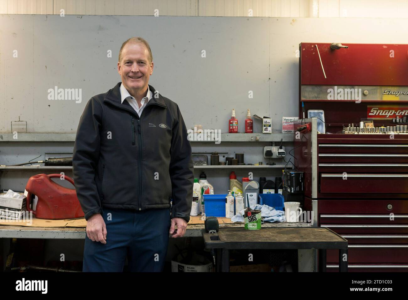 A Land Rover garage owner stands in his mechanics workshop for a ...