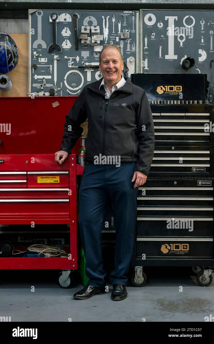 A Land Rover garage owner stands in his mechanics workshop for a ...
