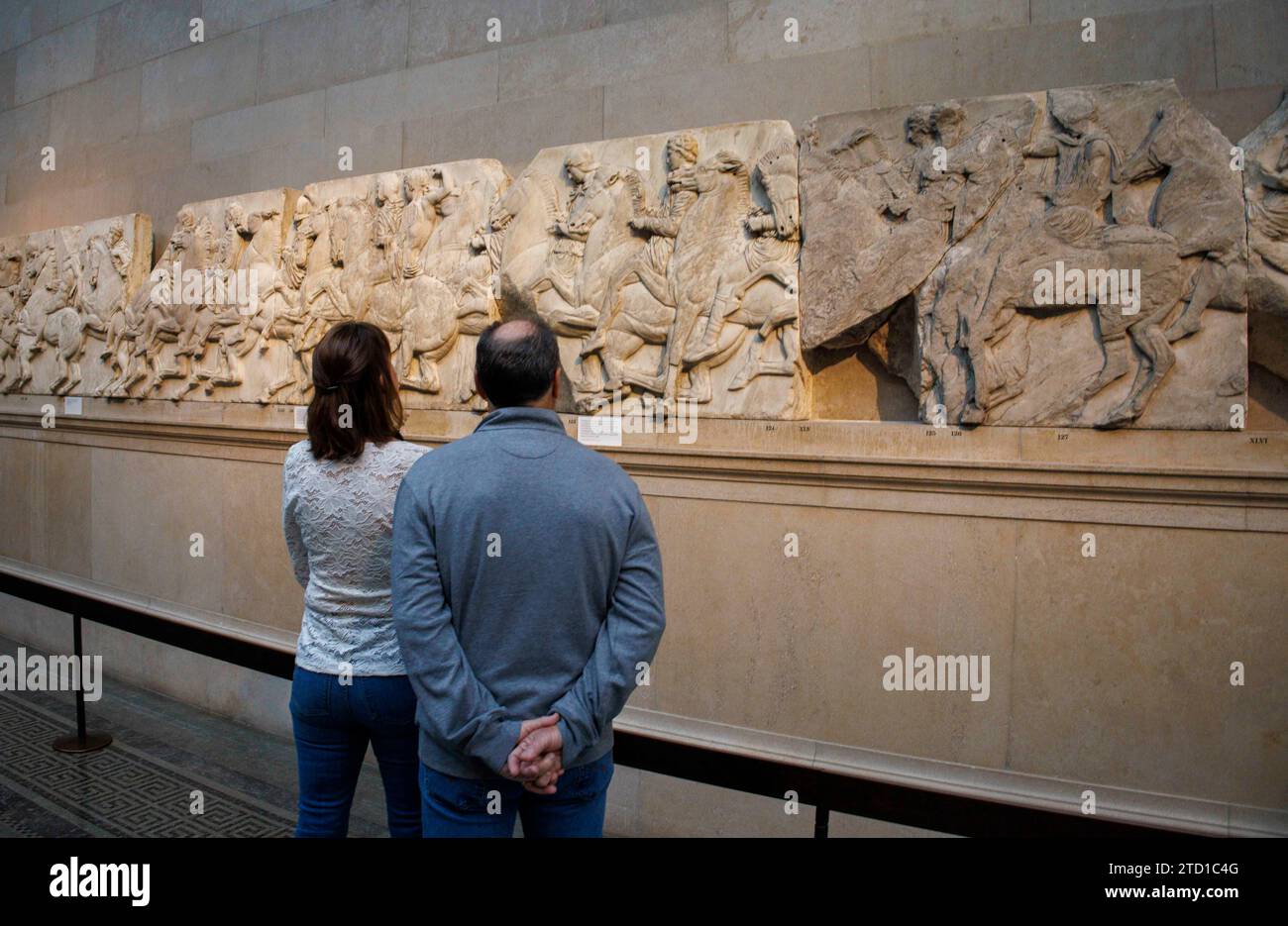 London, UK 15 Dec 2023 Visitors looking at the sculptures. The Elgin Marbles in the Parthenon ...