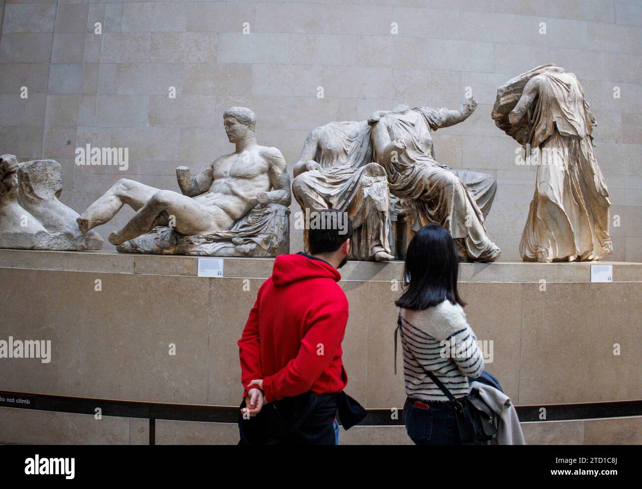 London, UK 15 Dec 2023 Visitors looking at the sculptures. The Elgin Marbles in the Parthenon ...