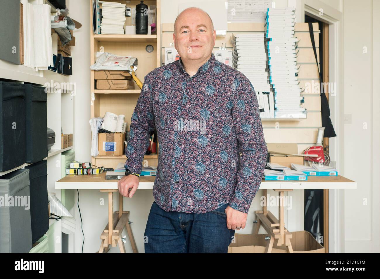 A small business owner and technology manufacturer poses for a portrait ...