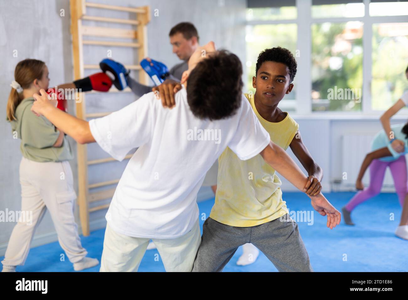 Two boys practicing self-defense techniques Stock Photo - Alamy