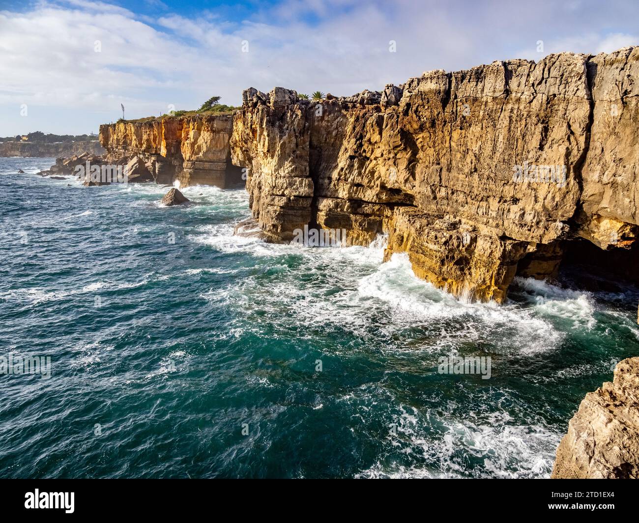 Rugged cliffs on the Atlantic Ocean coast from the Boca do Inferno ...