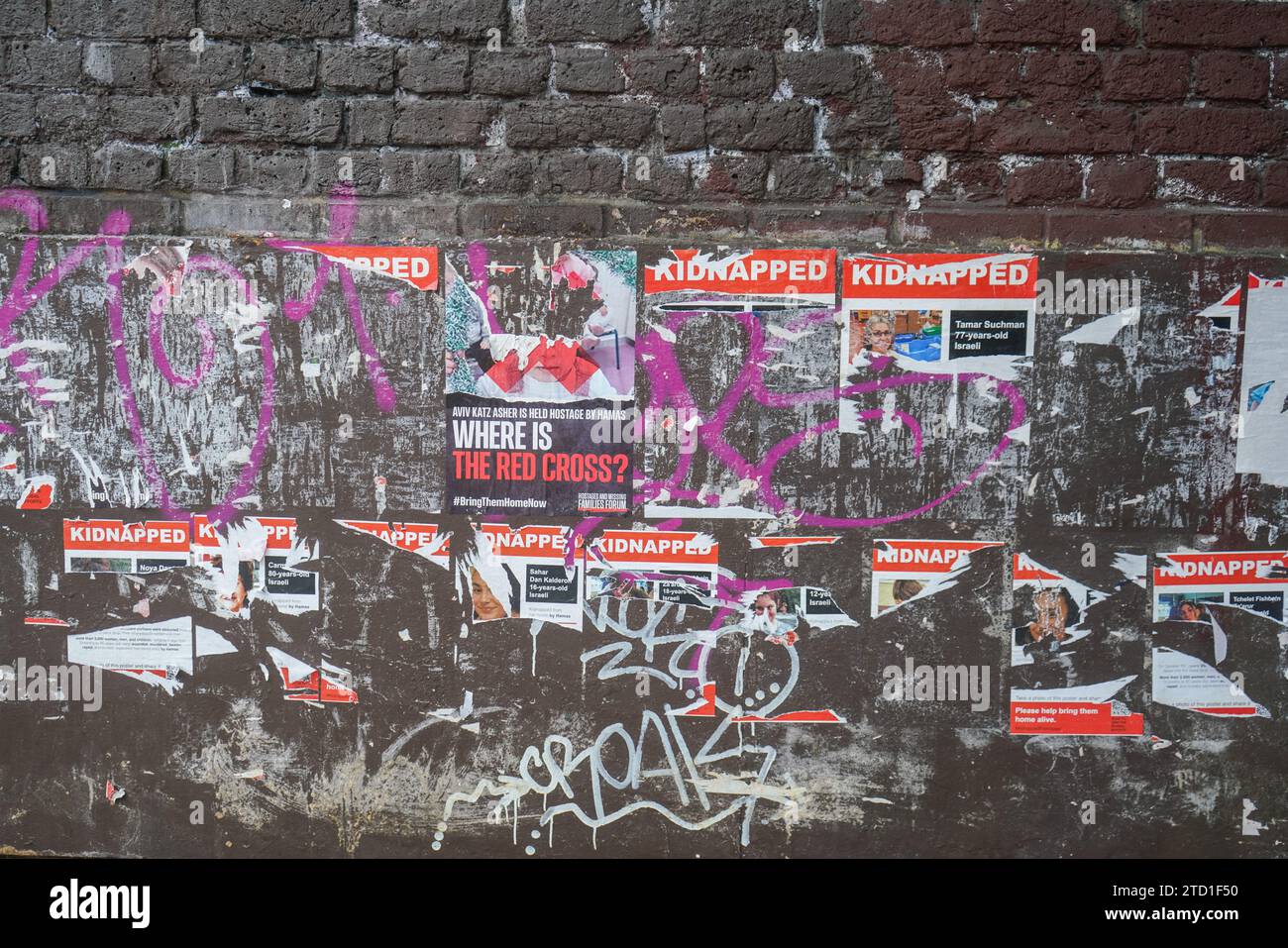 Posters of Israeli hostages seized by Hamas are damaged, torn and ...