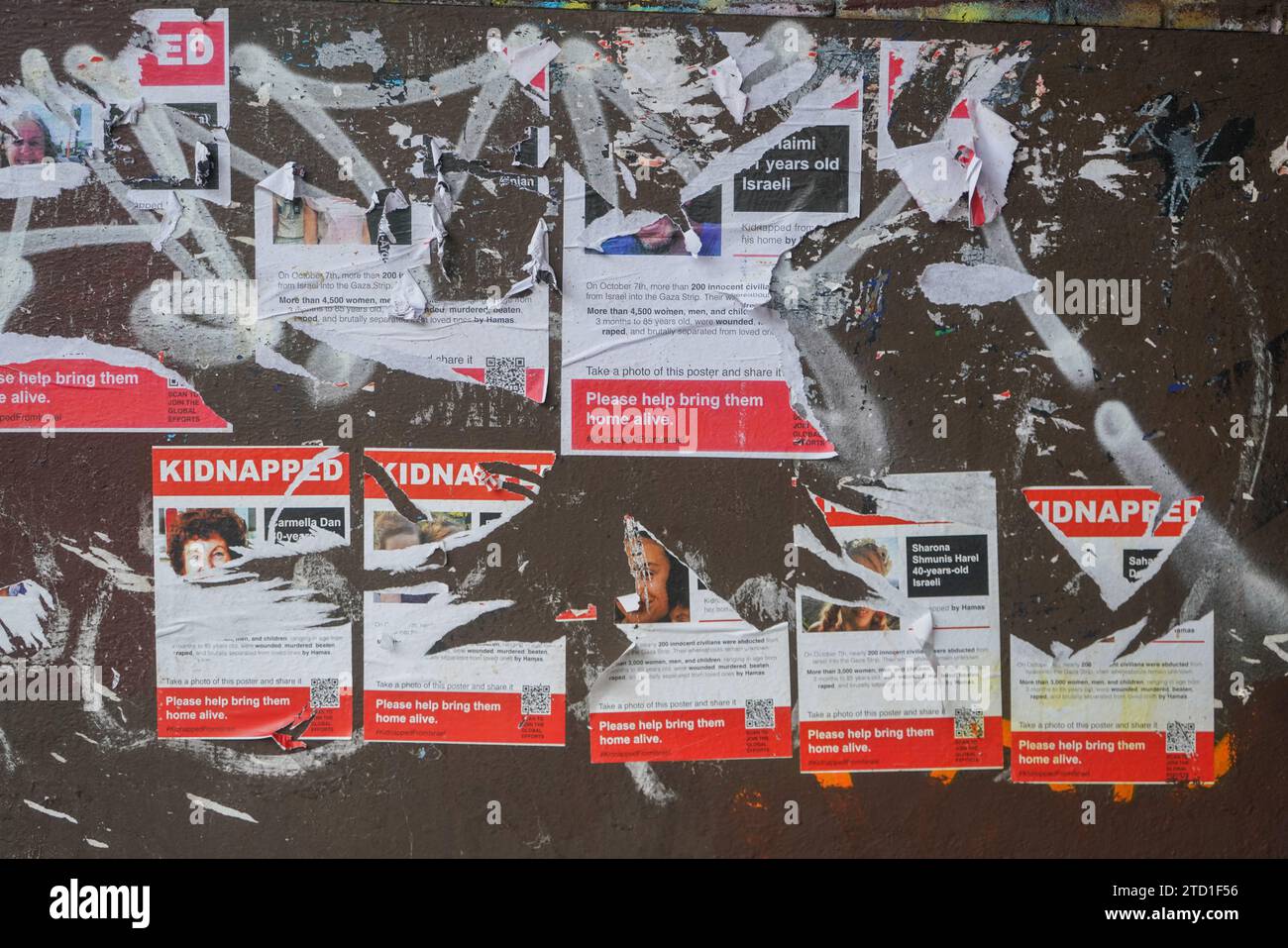Posters of Israeli hostages seized by Hamas are damaged, torn and ...