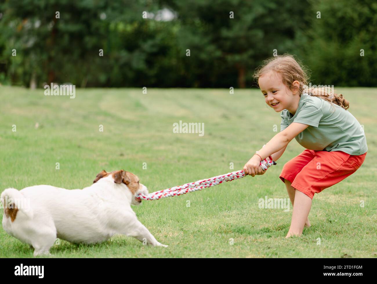 Child and dog and tug hi-res stock photography and images - Alamy