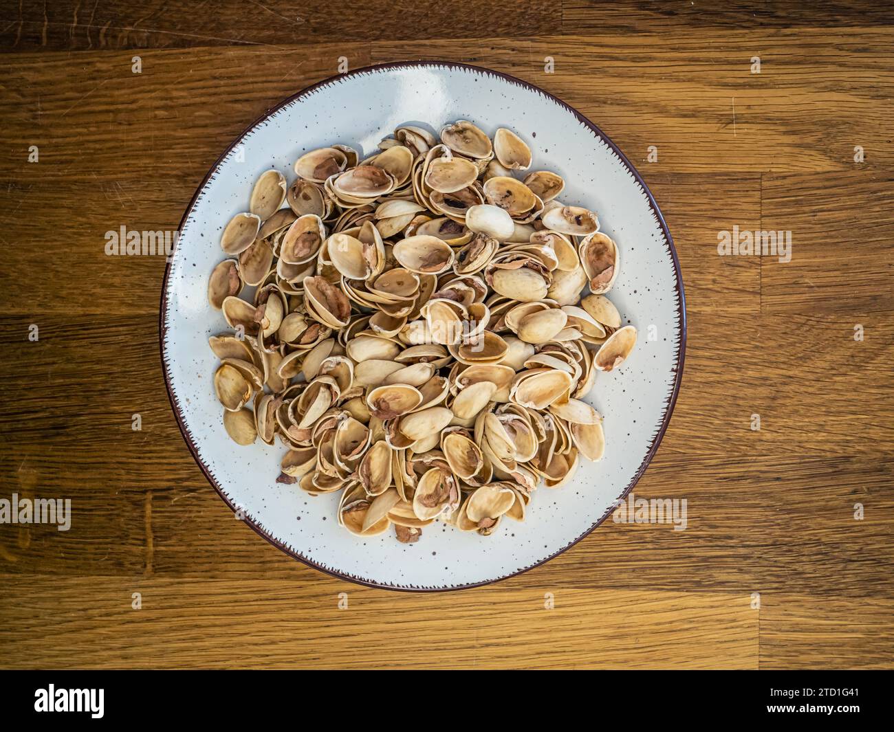 Large plate bowl of empty pistachio shells eaten pistachios remains ...