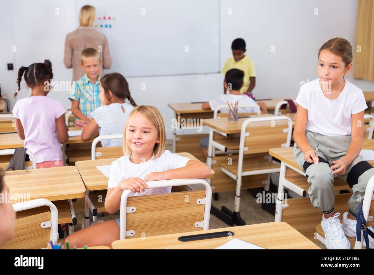 Kids pupils talking during recess between lessons Stock Photo - Alamy