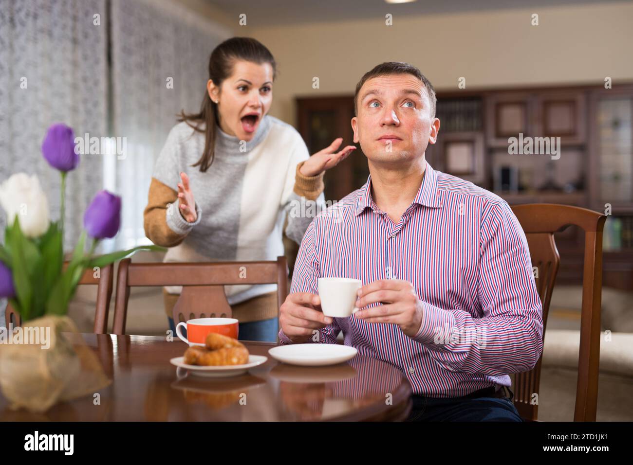 Woman scolding her husband Stock Photo - Alamy