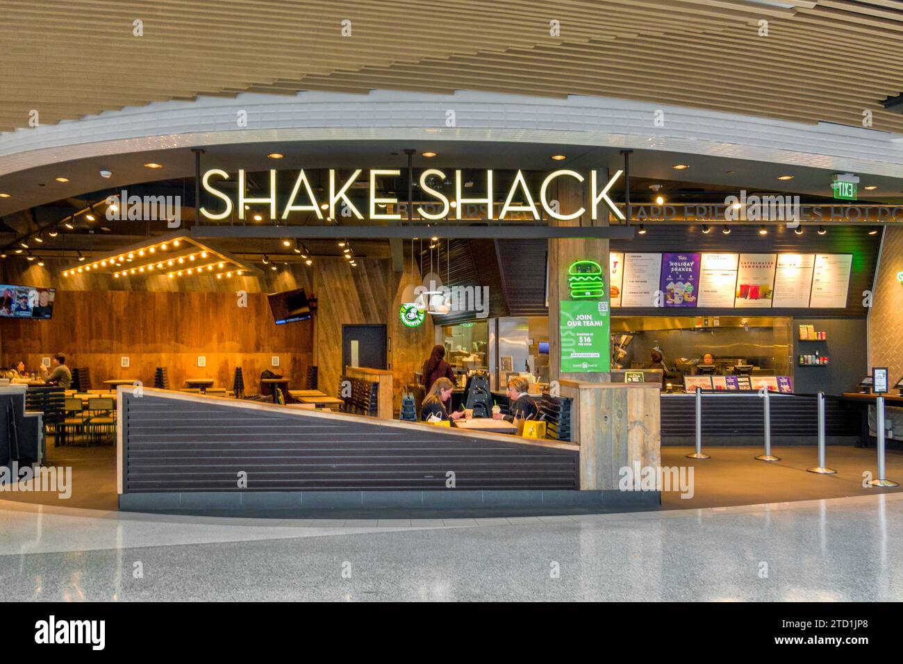BLOOMINGTON, MN, USA - DECEMBER 12, 2023 Shake Shack and unidentified individuals at the Mall of ...