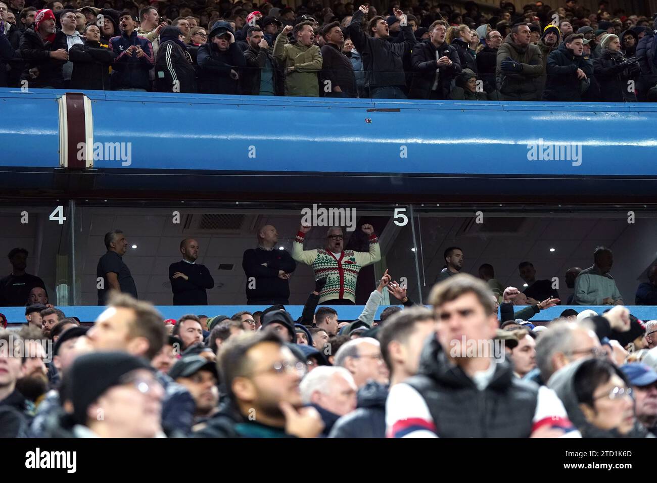 Aston Villa fans in a box celebrate their side's first goal of the game ...
