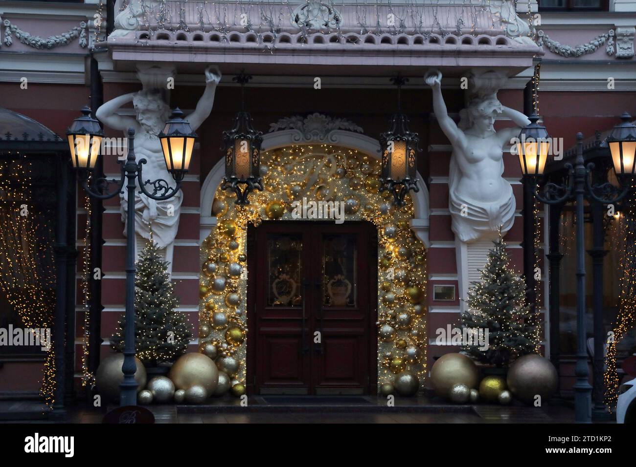 Decorations are adorning the entrance flanked by statues during the ...