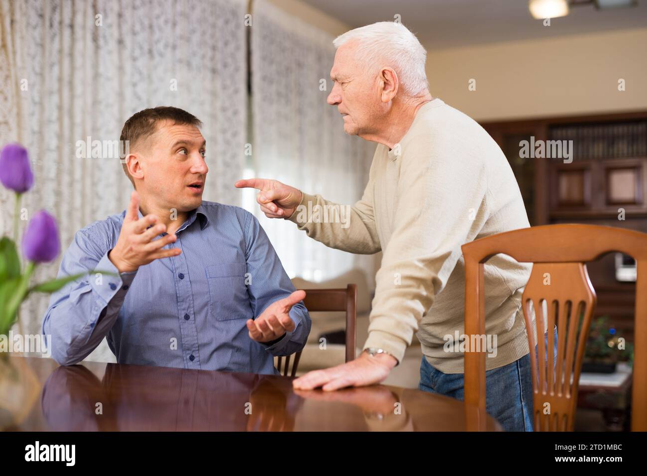 Home quarrel between father and adult son Stock Photo - Alamy