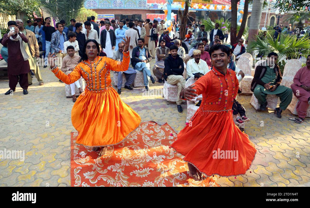 Artists are performing traditional dance on stage during the Sindh Sufi ...