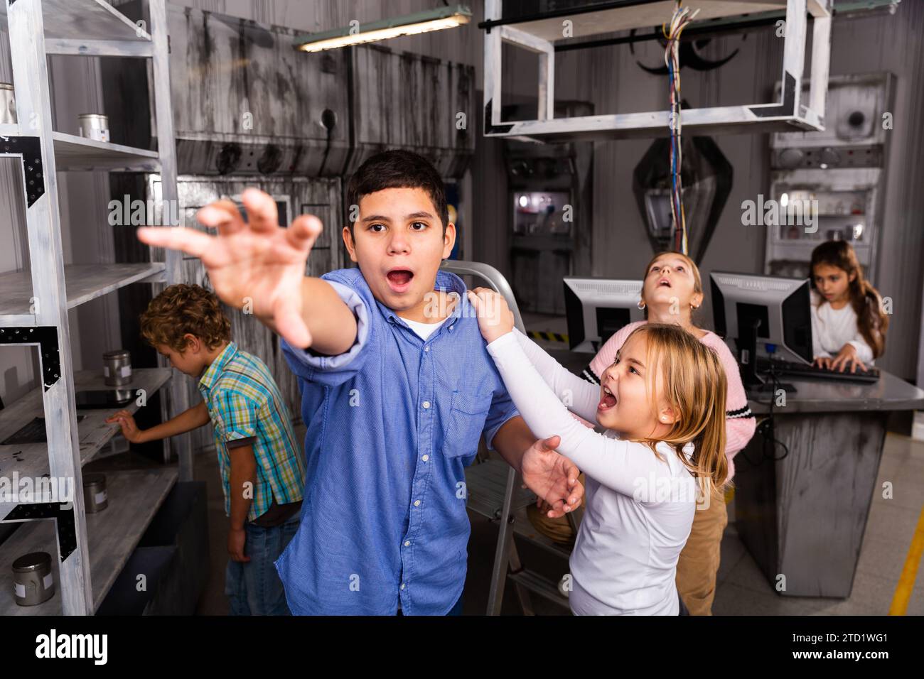 Quest game - children keep a boy turned into zombie Stock Photo - Alamy