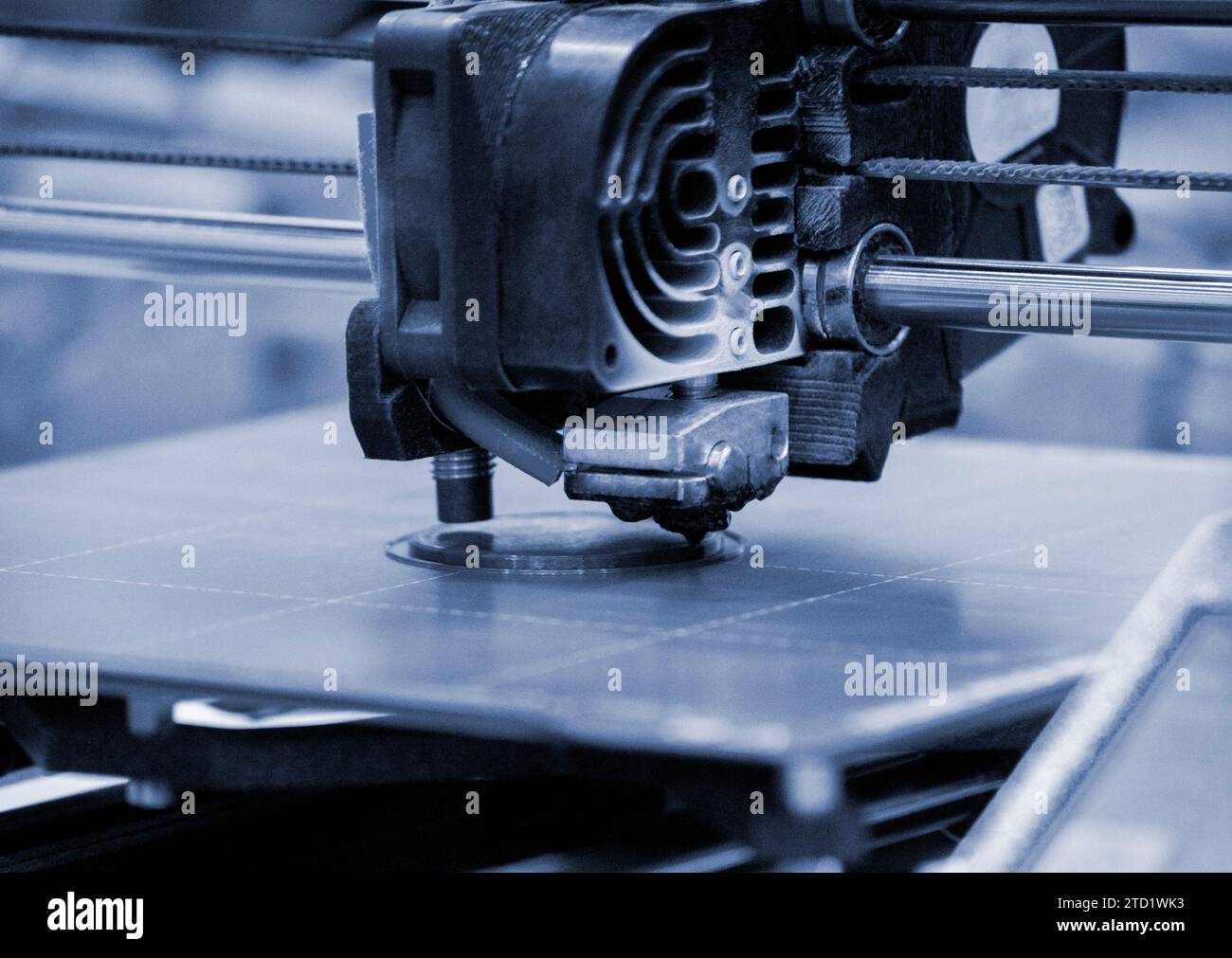 3D printer printing prototype from molten plastic. Process of creating ...