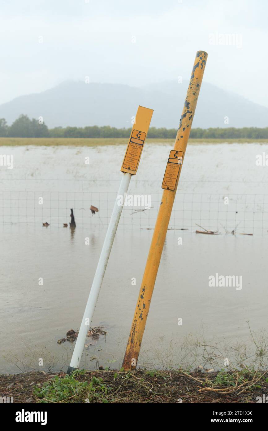 Telstra telecon poles begin to fall after flood erosion in the Cairns ...