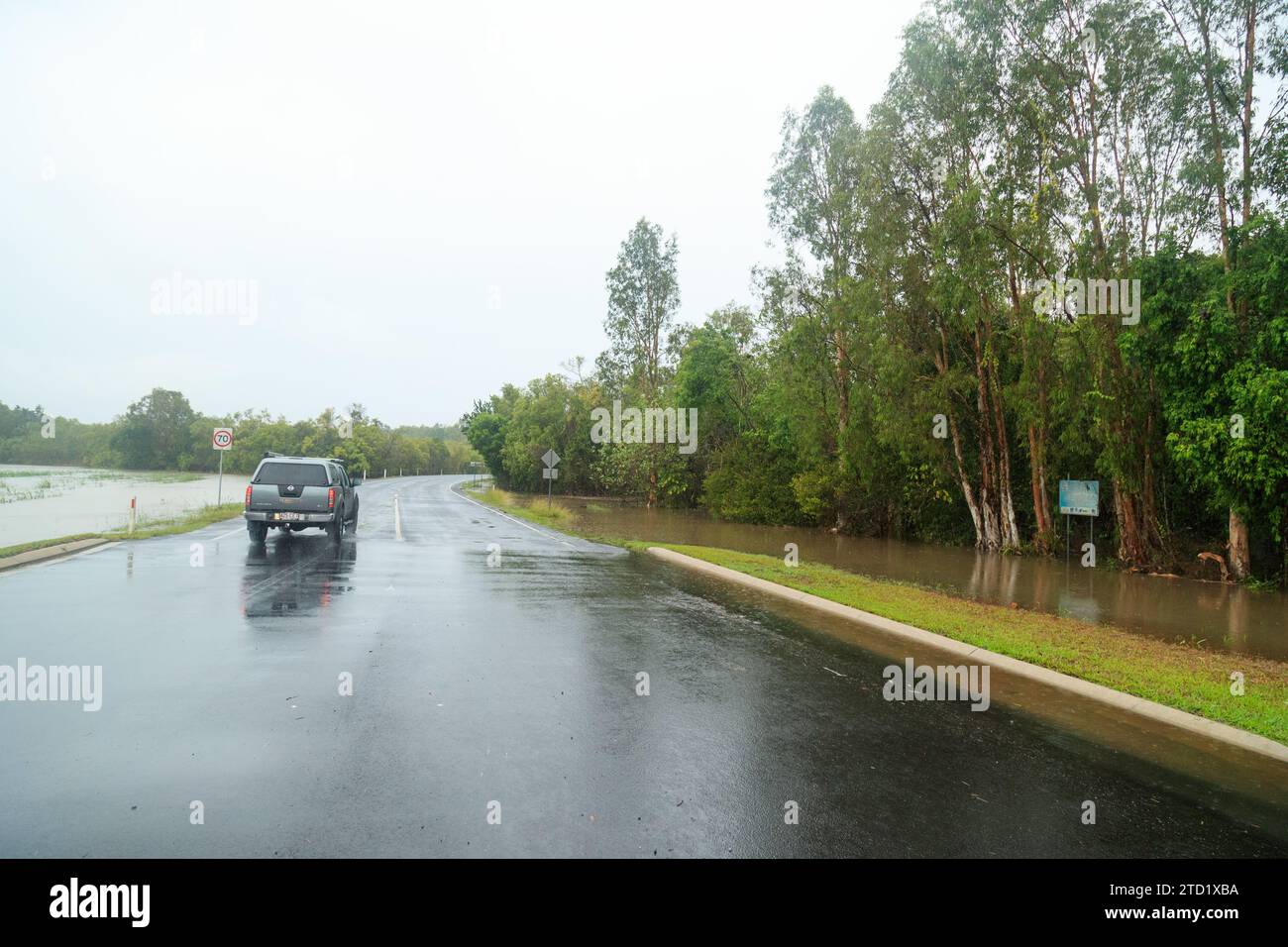 Cars attempt to pass a road in the northern beaches suburb of Holloways ...