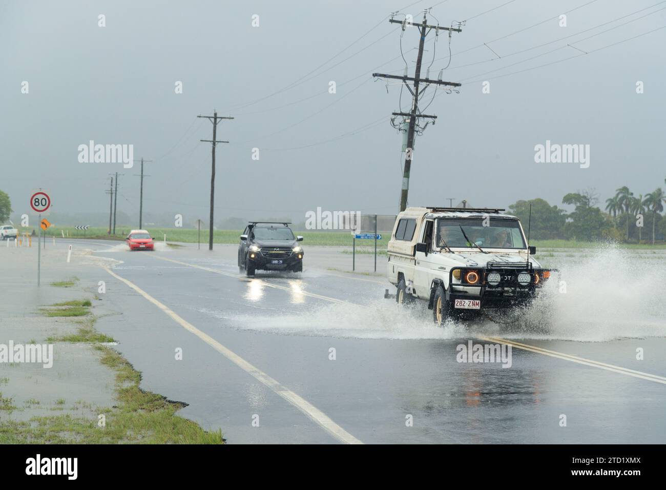 Cars attempt to pass a road in the northern beaches suburb of Holloways ...
