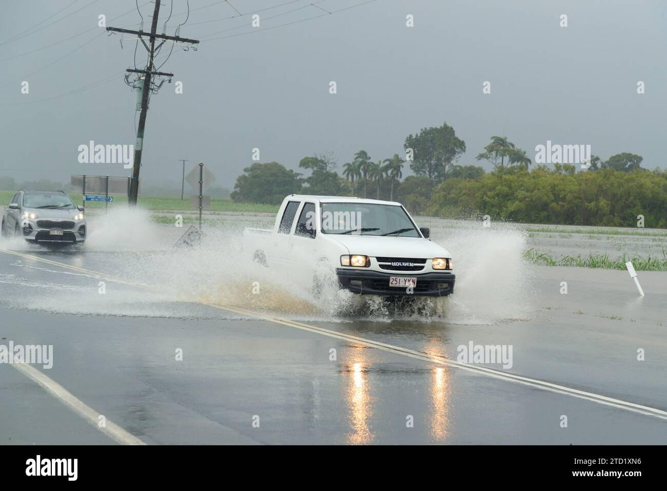 Cars attempt to pass a road in the northern beaches suburb of Holloways ...