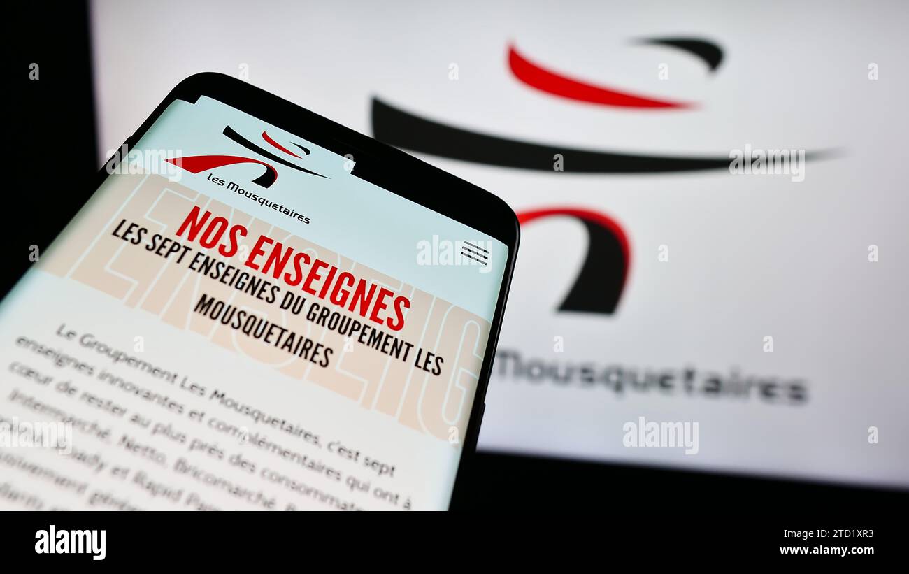 Mobile phone with website of French company ITM Entreprises S.A. (Les ...