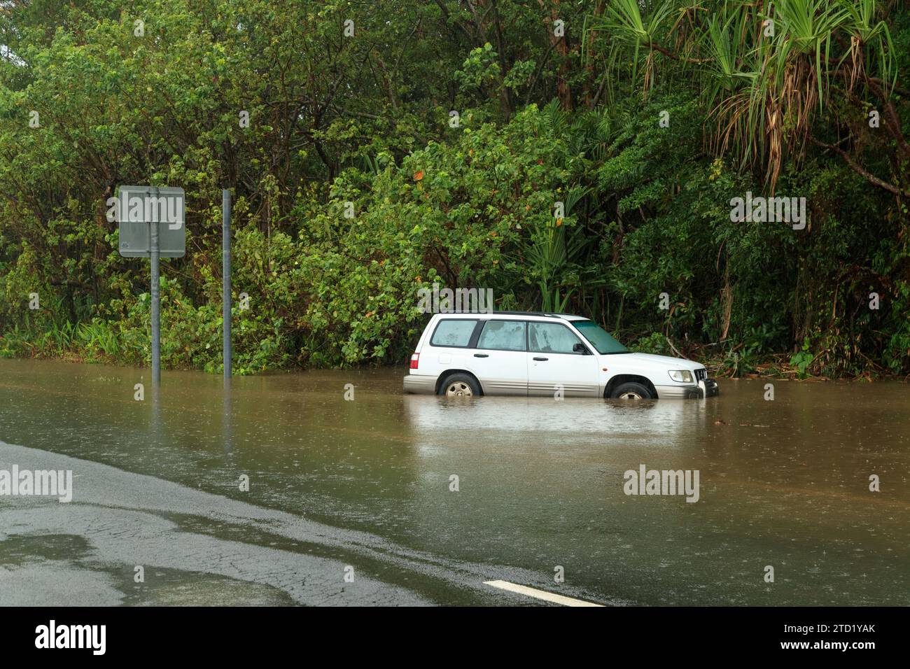 December 15, 2023, Cairns, Queensland, Australia: A car inundated with ...