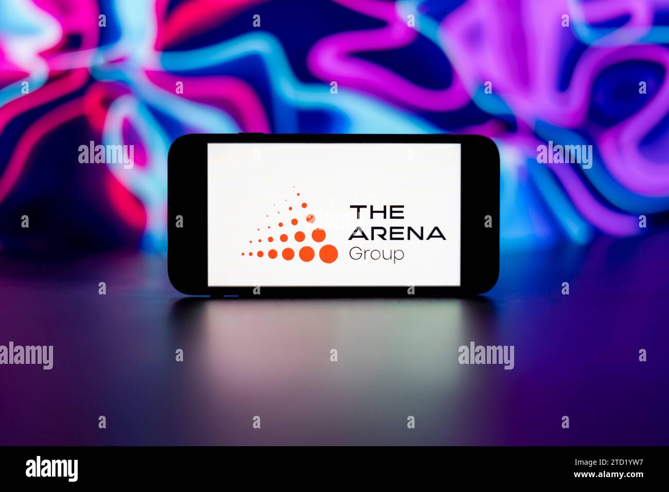 In this photo illustration, the Arena group logo is seen displayed on a ...