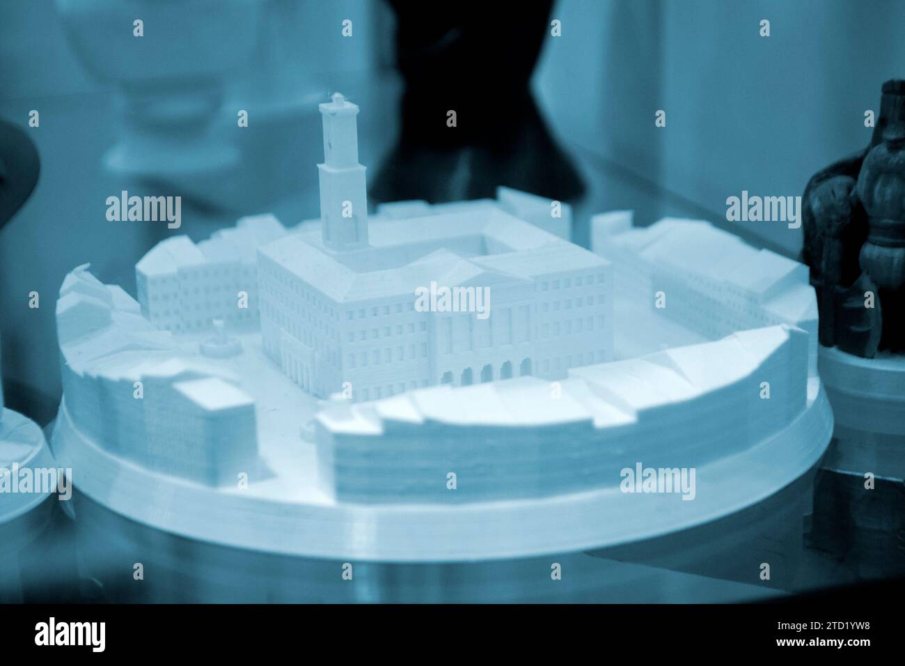 Prototype of building 3D printed from melted white plastic. Close-up ...