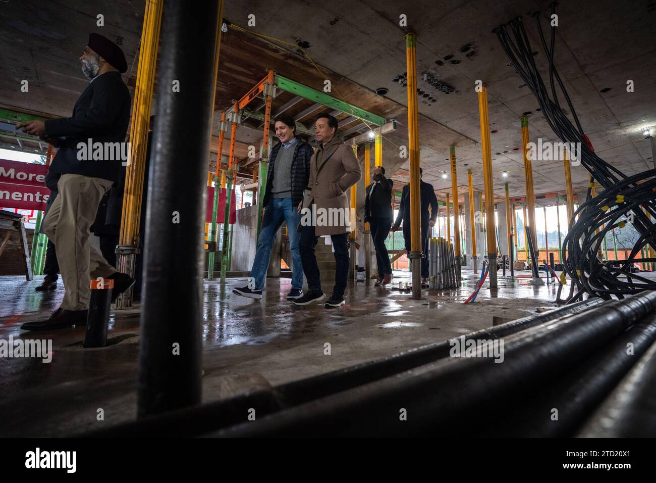 Prime Minister Justin Trudeau and Vancouver Mayor Ken Sim walk to a ...