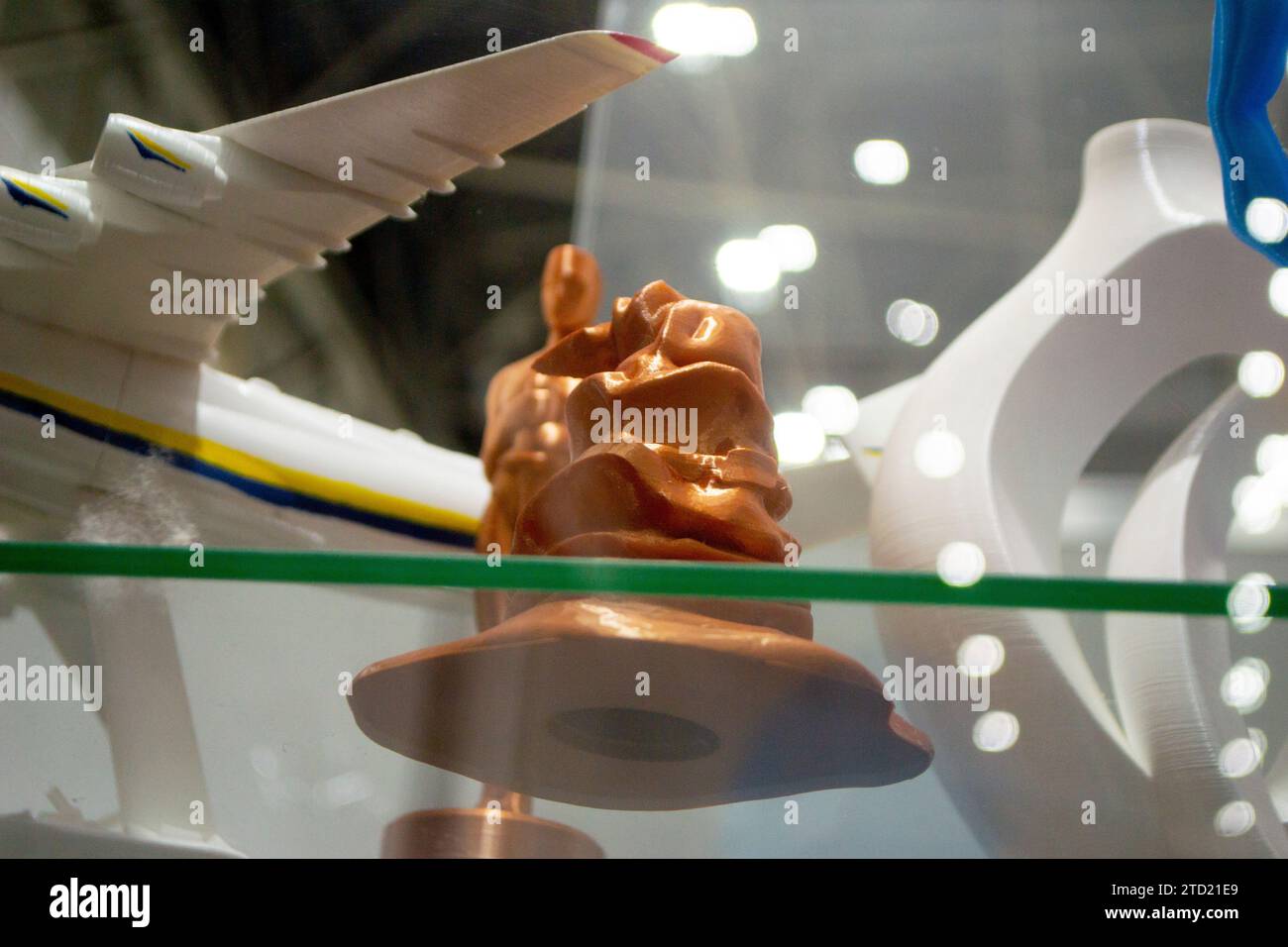 Prototype of art object 3D printed from melted brown plastic. Model of ...