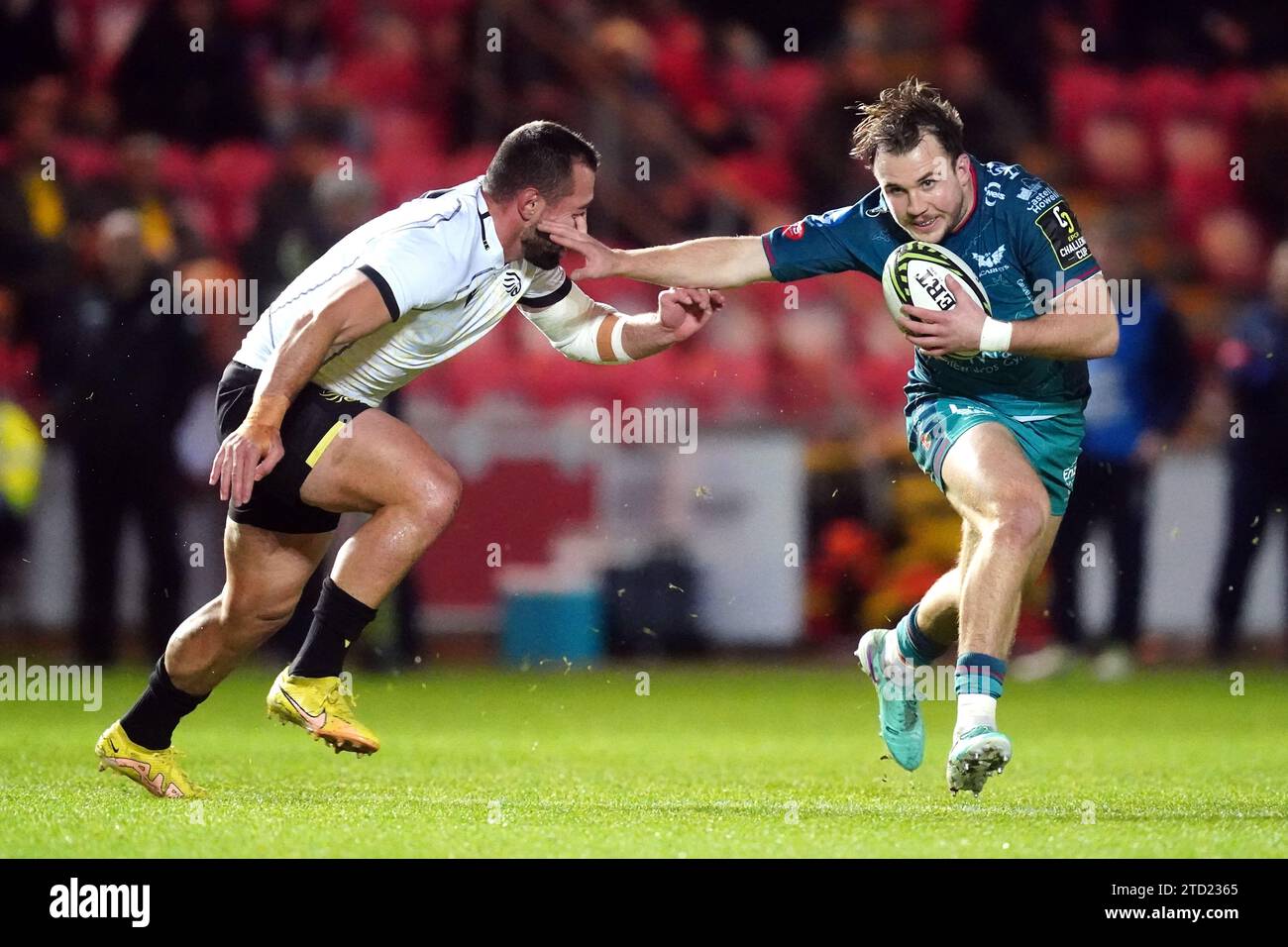 Scarlets' Ioan Lloyd (right) attempts to get past Black Lion's Merab ...