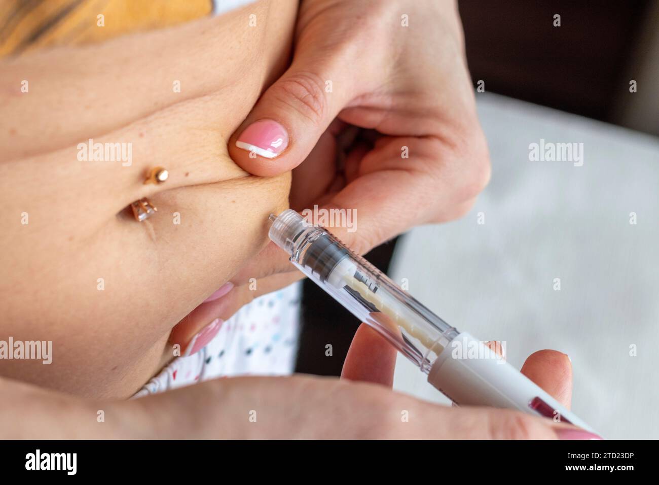 Close up shot of the woman with beautiful hands, preparing hormone ...