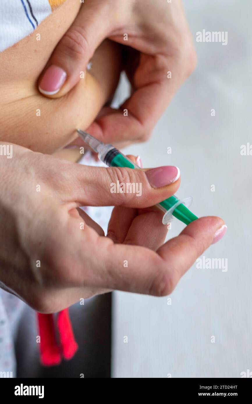 Close up shot of the woman with beautiful hands, preparing hormone ...