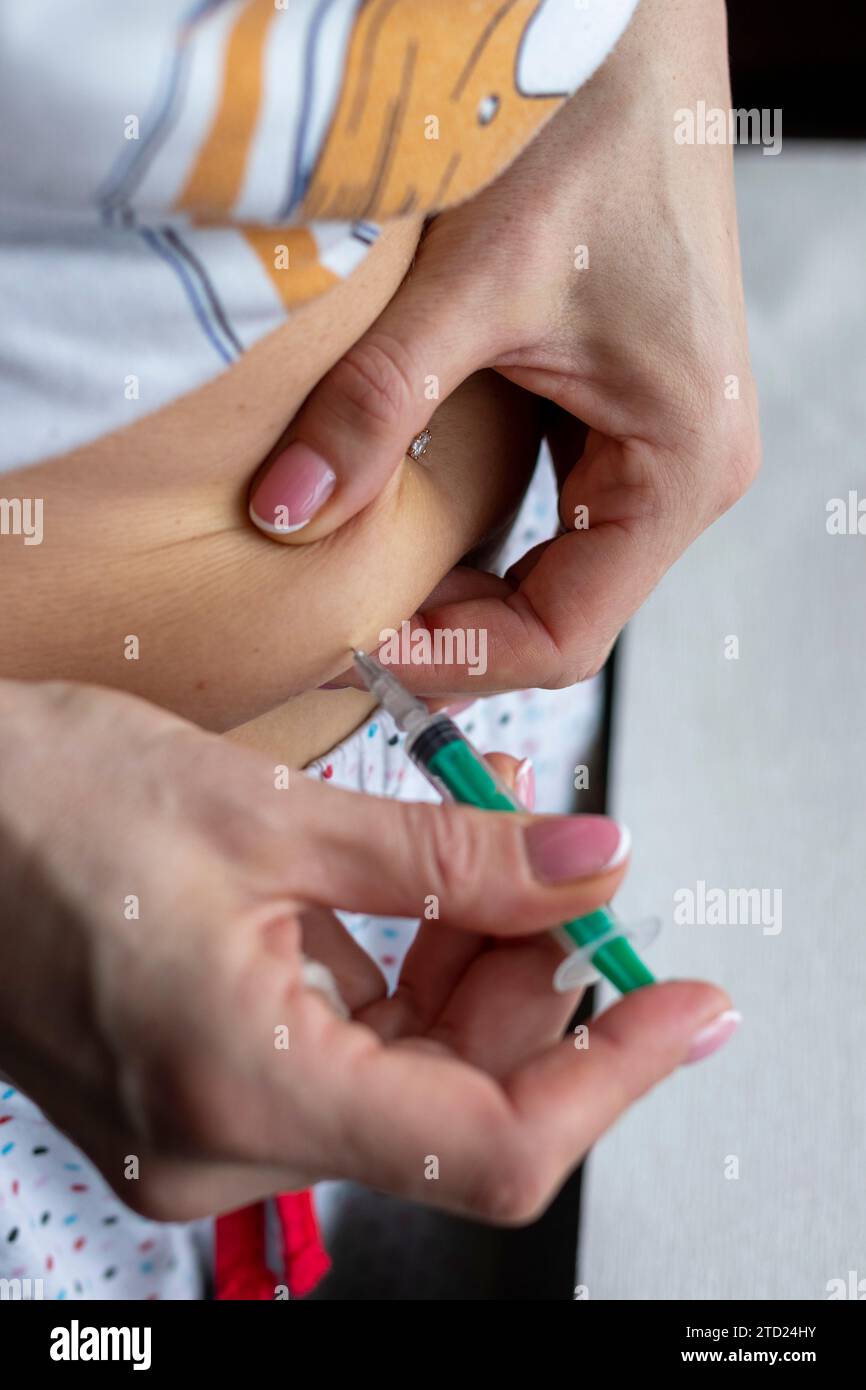 Close up shot of the woman with beautiful hands, preparing hormone ...