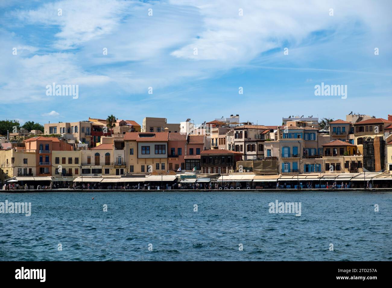 Greece, Chania Town Crete. View of outdoors cafe, seaside traditional ...