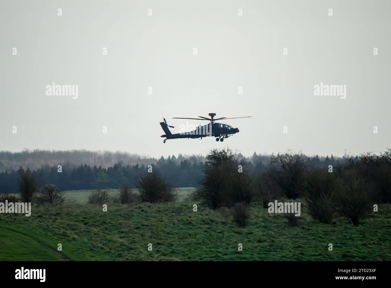 British army Apache AH64E AH-64E Helicopter Gunship in low level fligth ...