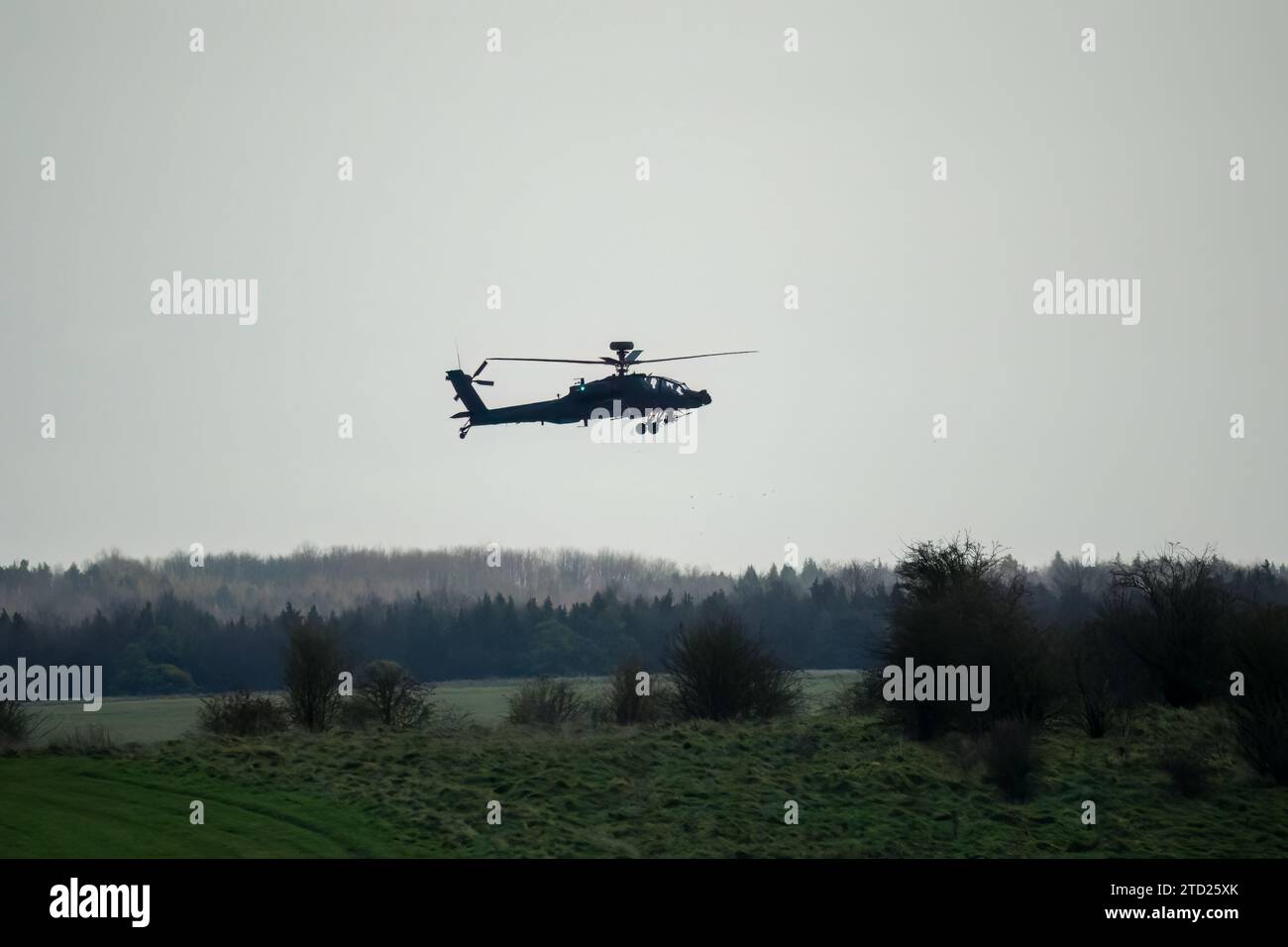 British army Apache AH64E AH-64E Helicopter Gunship in low level fligth ...